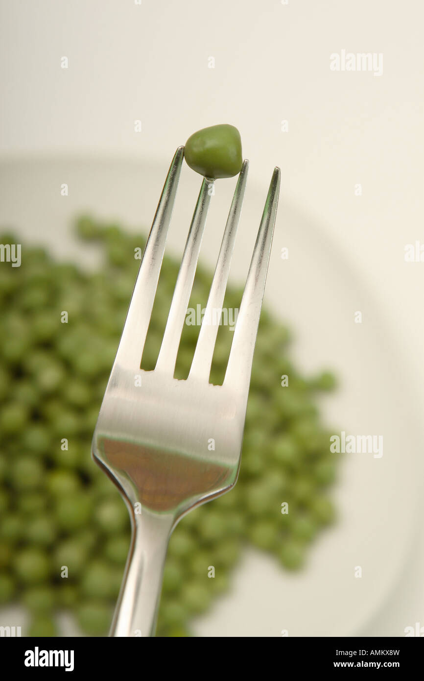 Fresh pea on fork hi-res stock photography and images - Alamy