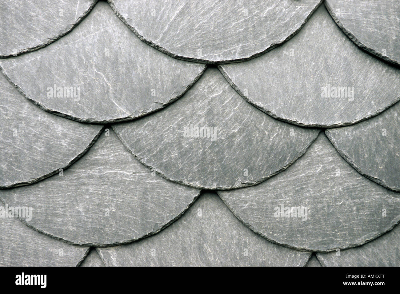 Cut roofing slates arranged in fish scale pattern Stock Photo - Alamy