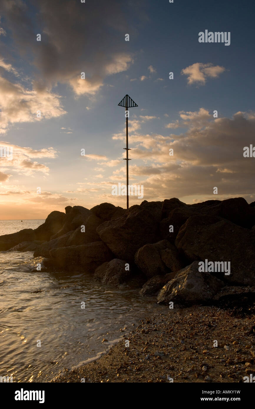 Rock breakwater with marker Stock Photo - Alamy