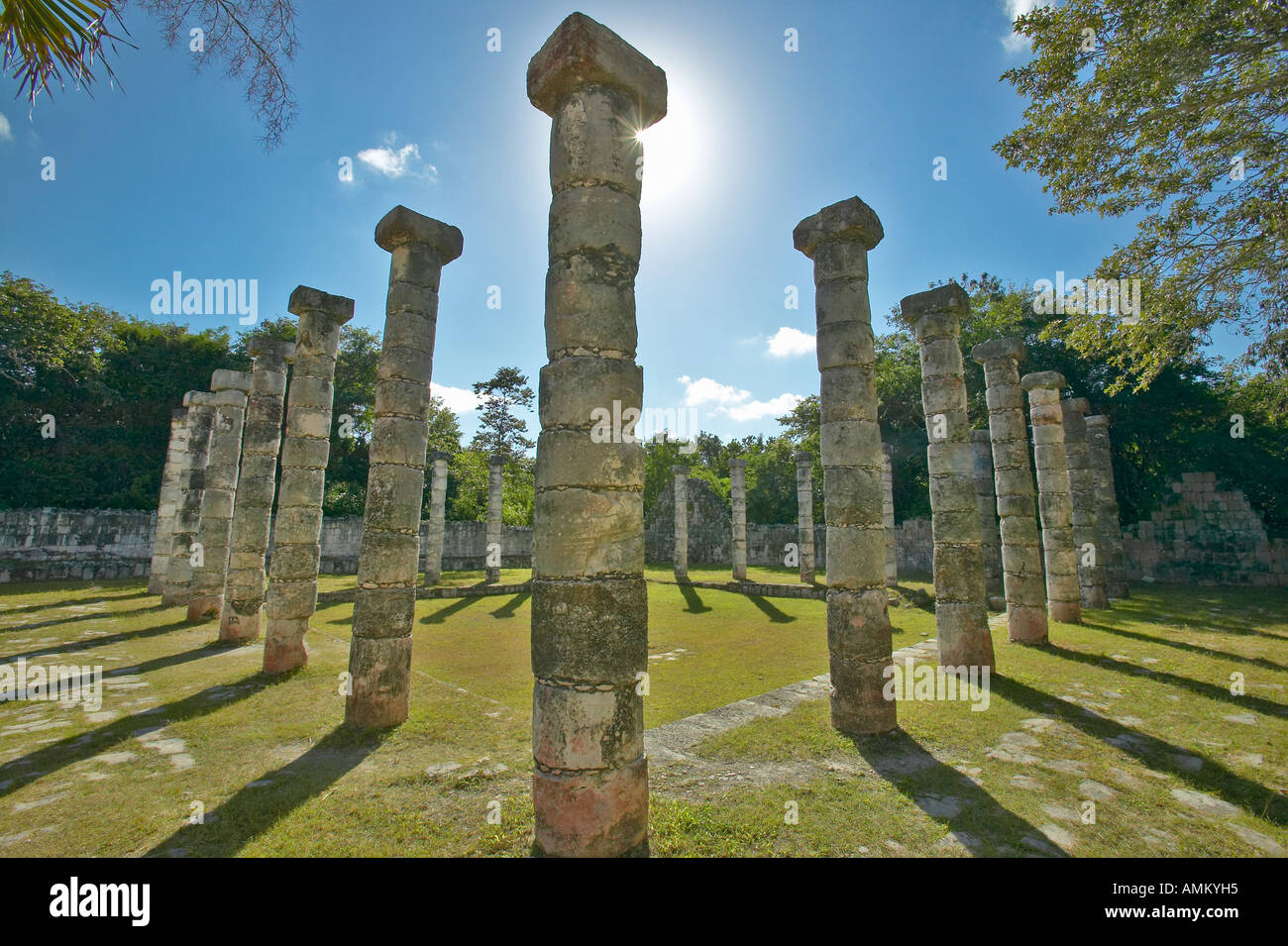 Columns surrounding grassy courtyard for ballgames at Chichen Itza ...