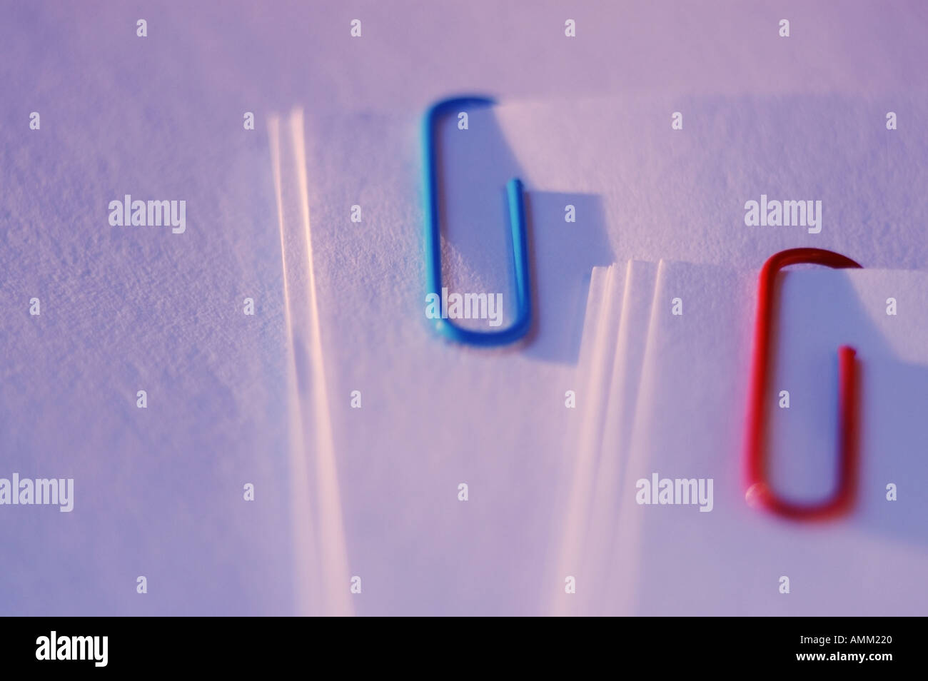 Paperclips and paper Stock Photo - Alamy