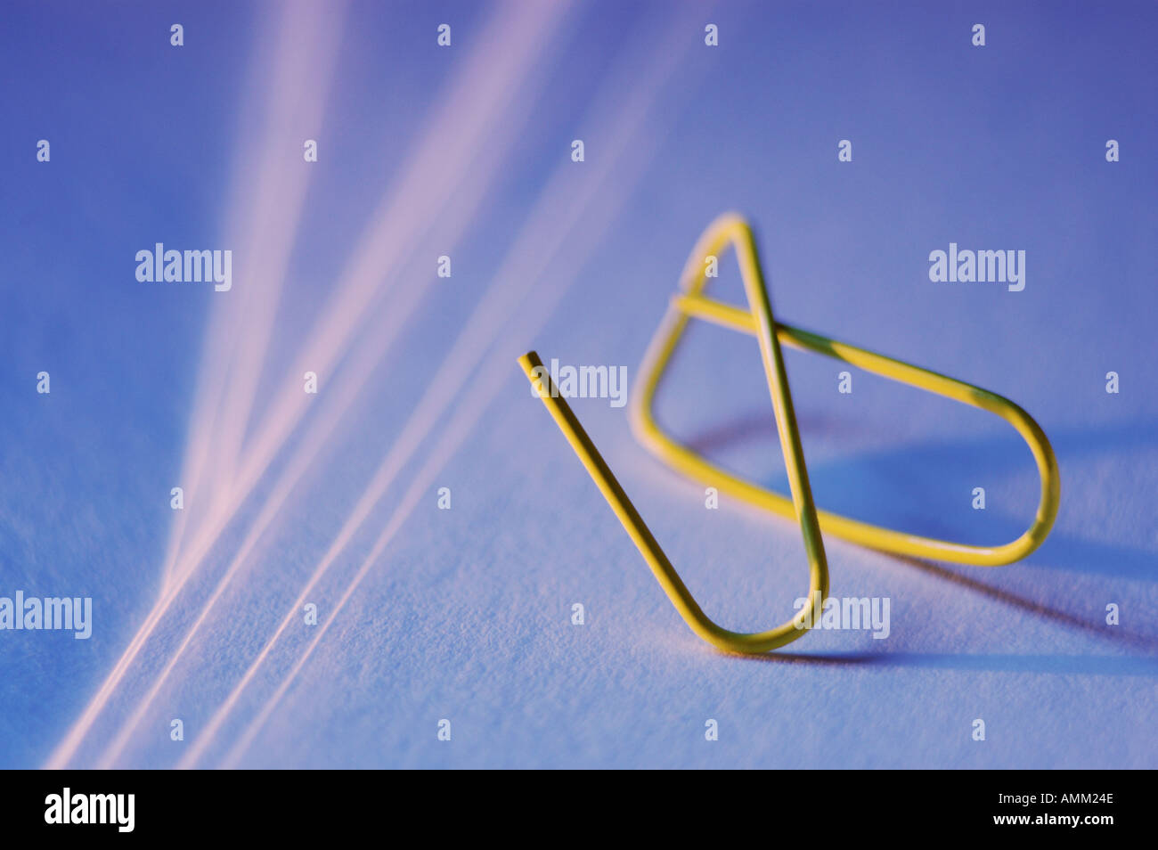 Twisted paperclip and paper Stock Photo - Alamy