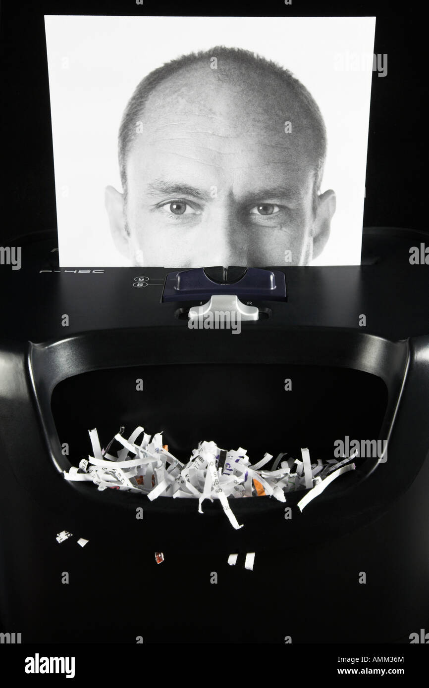 Photograph of a man s face being put through a paper shredder Stock ...