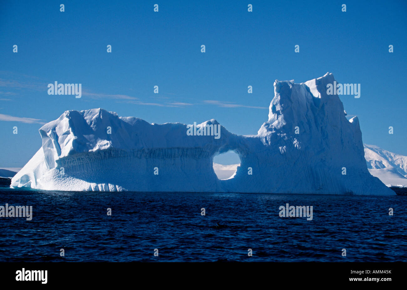 Weathered Iceberg with a circular window near Booth Island Stock Photo ...