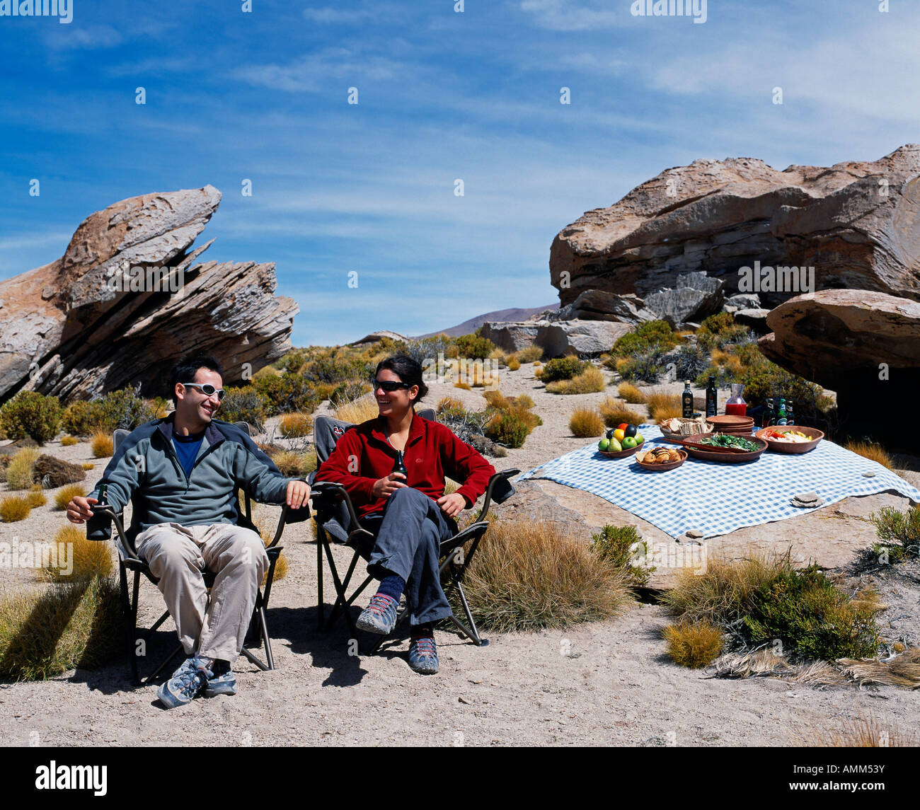 Tourists on the Explora Traversia of southern Bolivia enjoy a picnic ...
