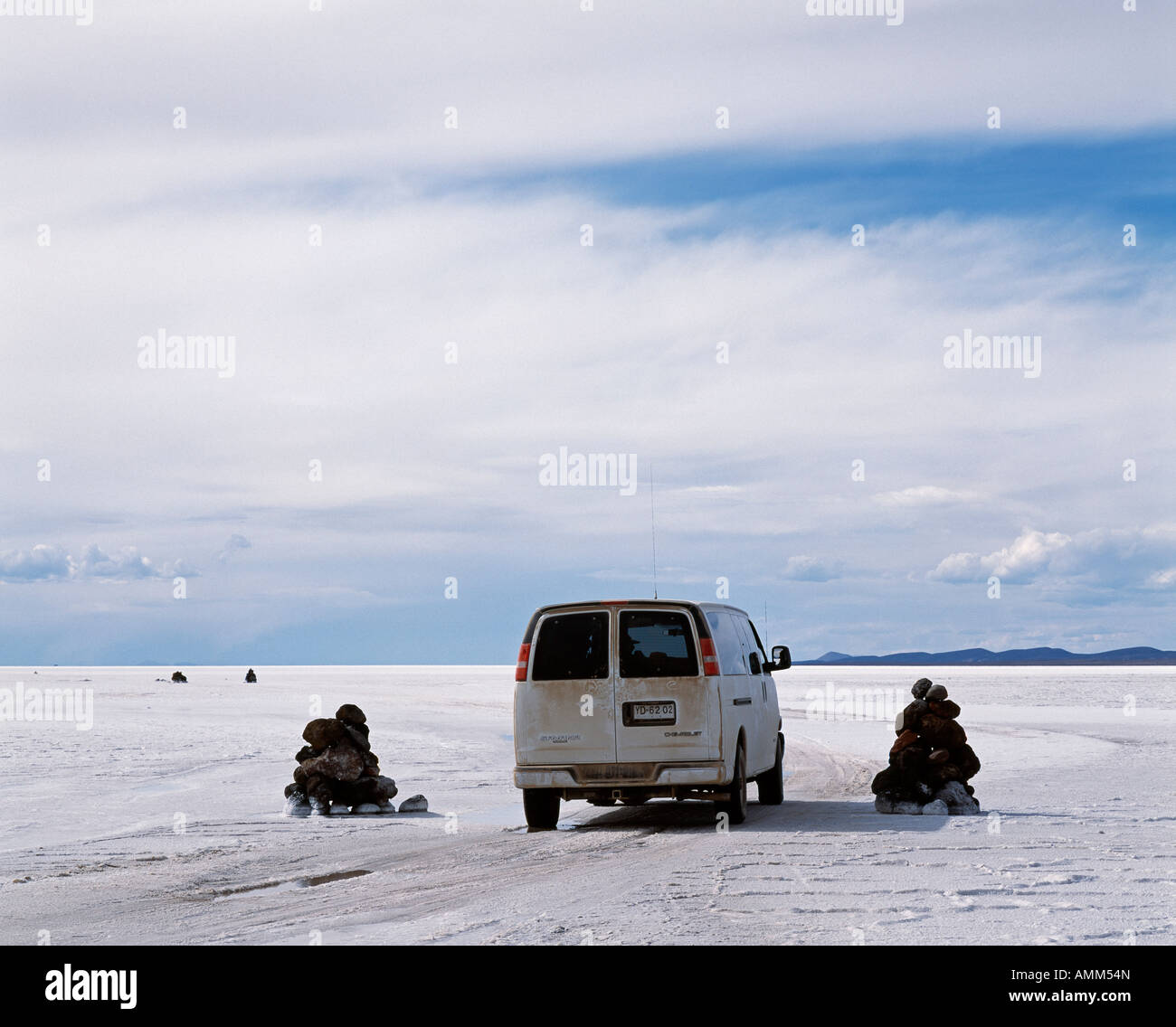 Stone cairns mark the safe entry point for vehicles onto the salt crust ...