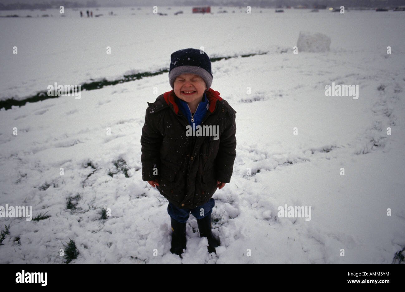 a young boy cold in the snow, Blackheath London Stock Photo - Alamy