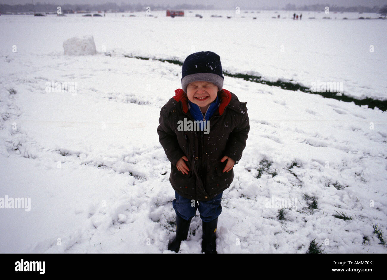 a young boy cold in the snow, Blackheath London Stock Photo - Alamy
