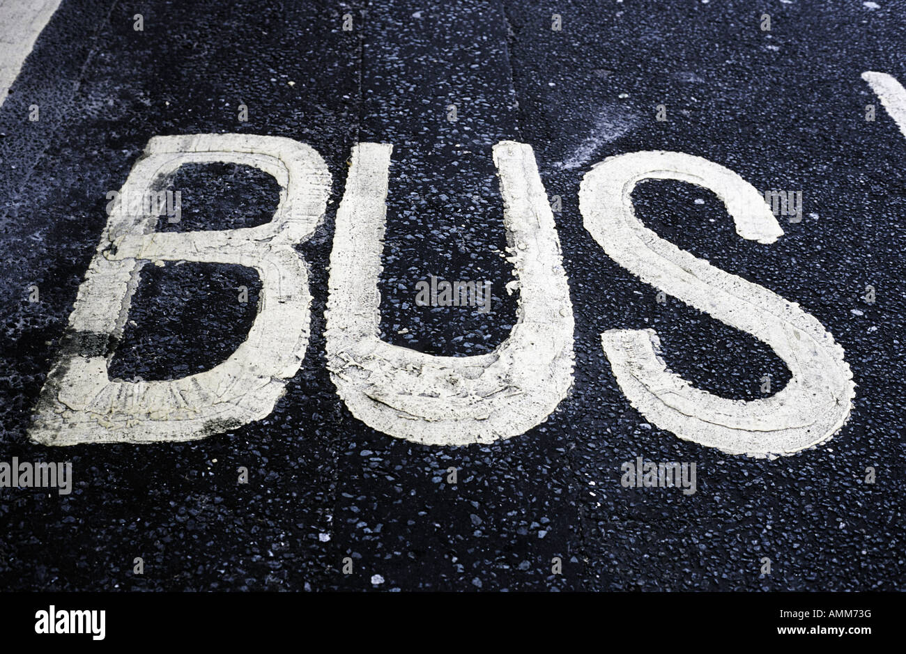bus sign painted on a tarmac road Stock Photo - Alamy