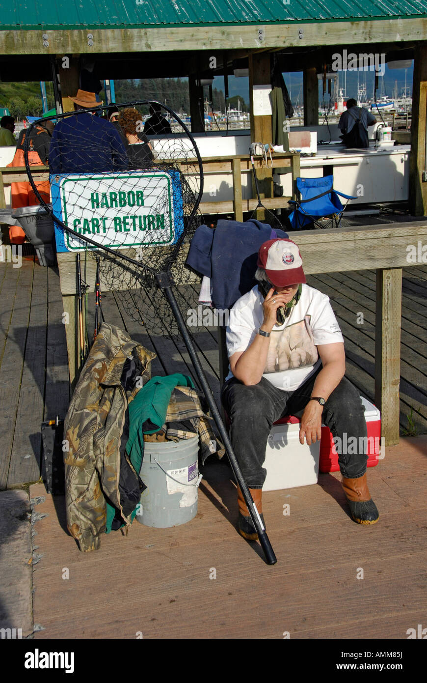 Fisherman talking on cell phone hi-res stock photography and images - Alamy