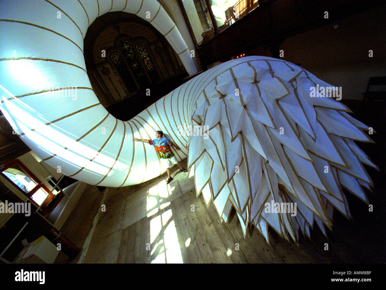 Artist creates recyled paper serpent form Stock Photo - Alamy