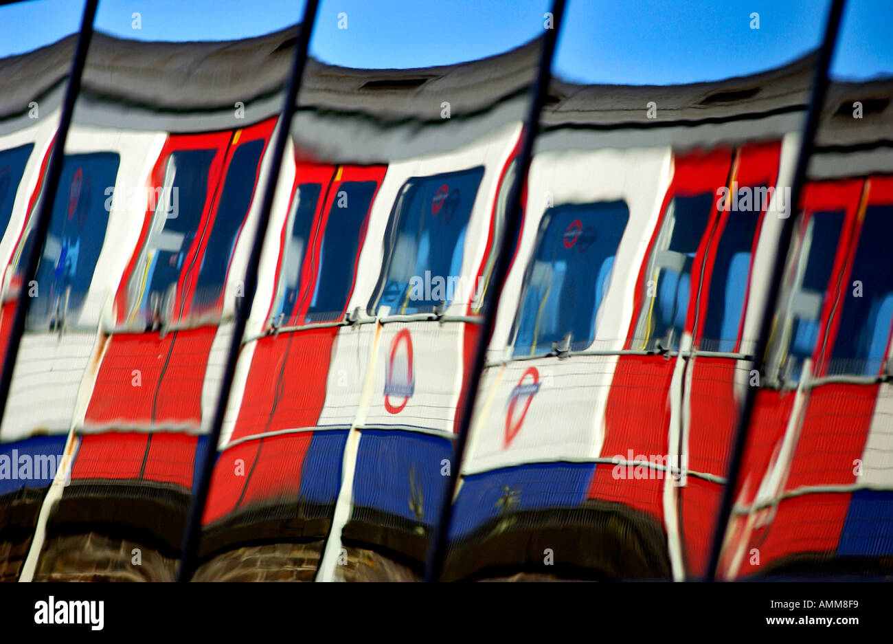 Reflected Tube Train on the Hammersmith and City line of the London ...