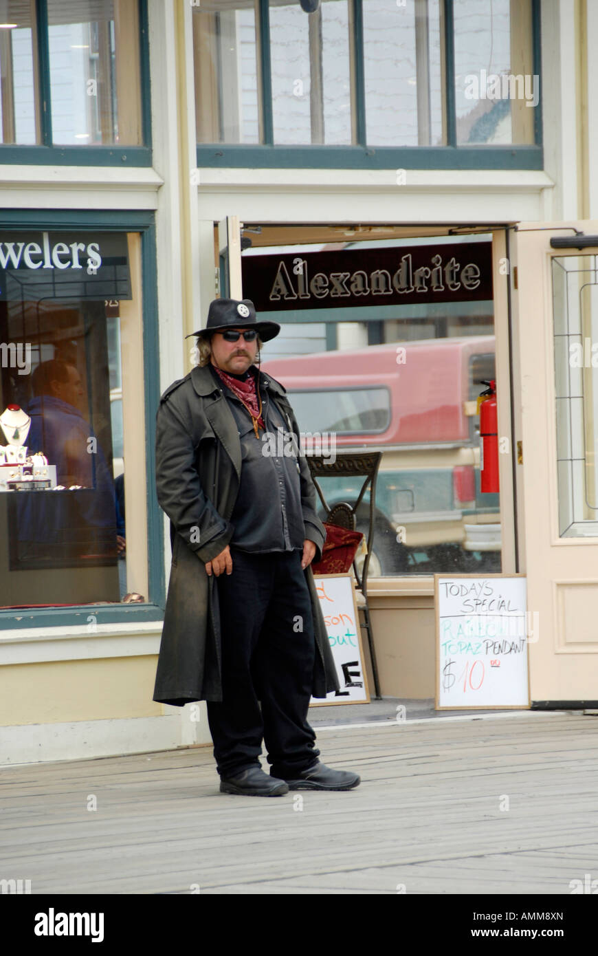 Character actor salesperson salesman attracts customers outside store ...