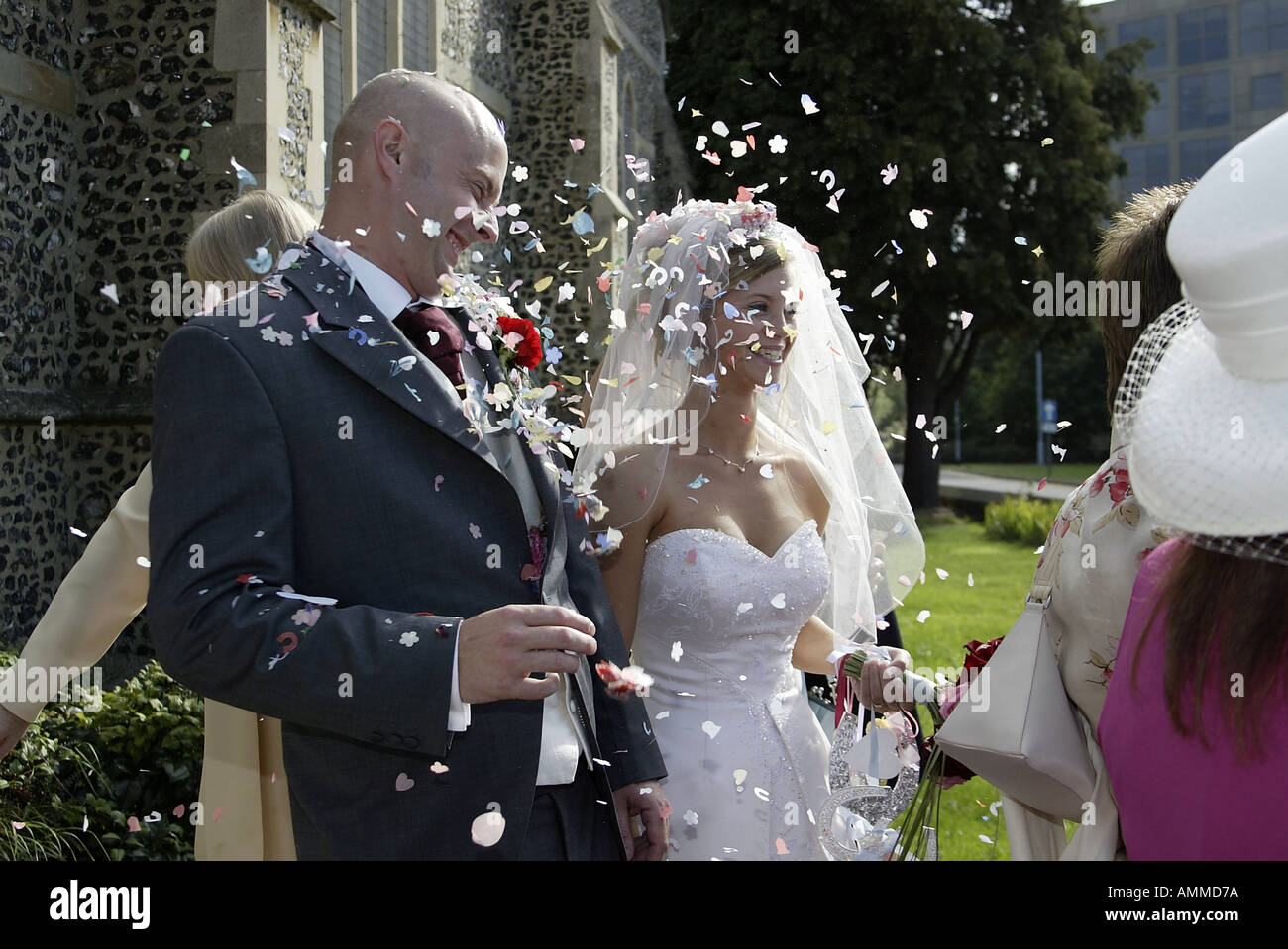 Bride and Groom with confetti Stock Photo - Alamy