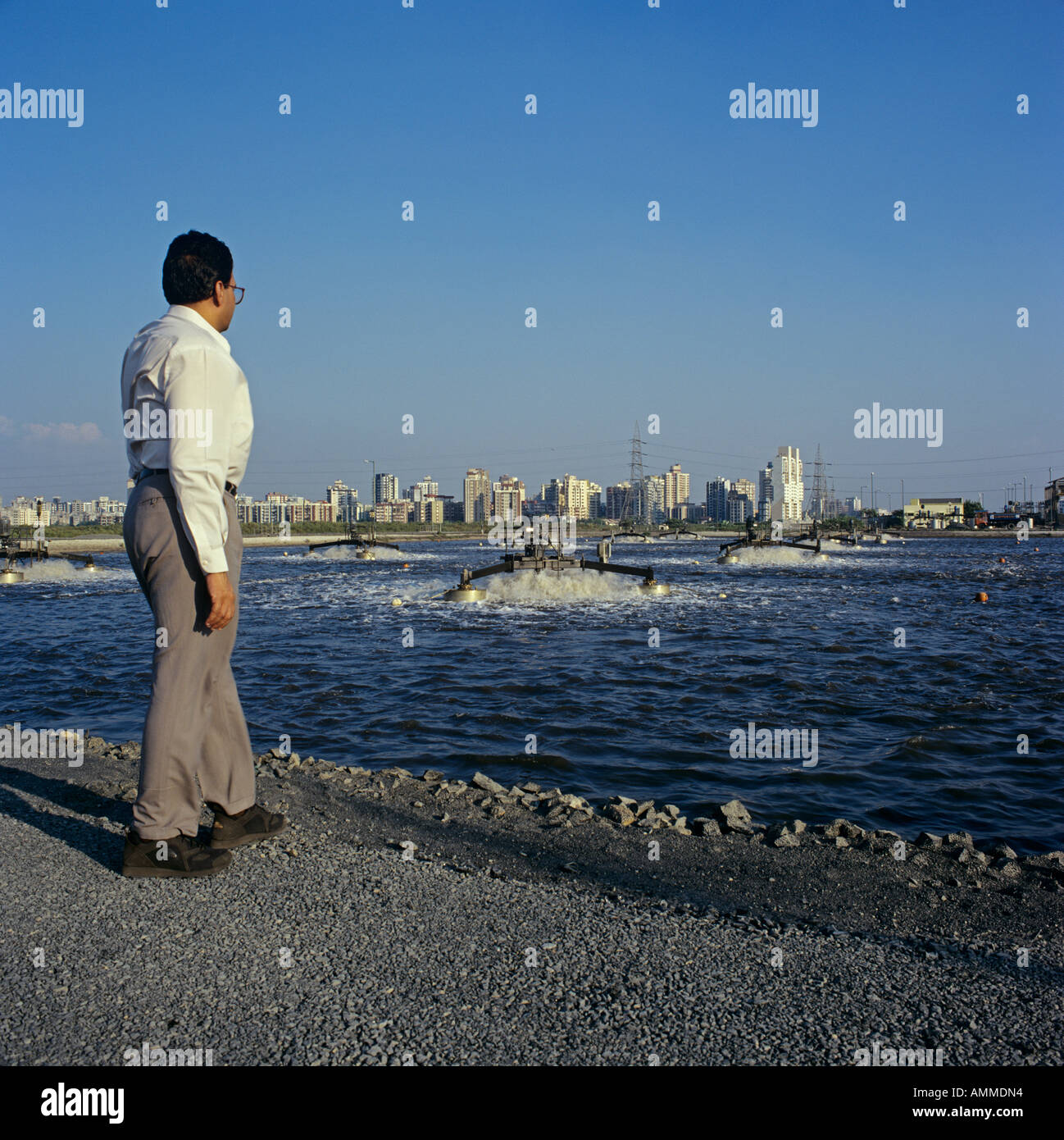 Floating aerators on sewage treatment lagoons, Mumbai, India Stock ...
