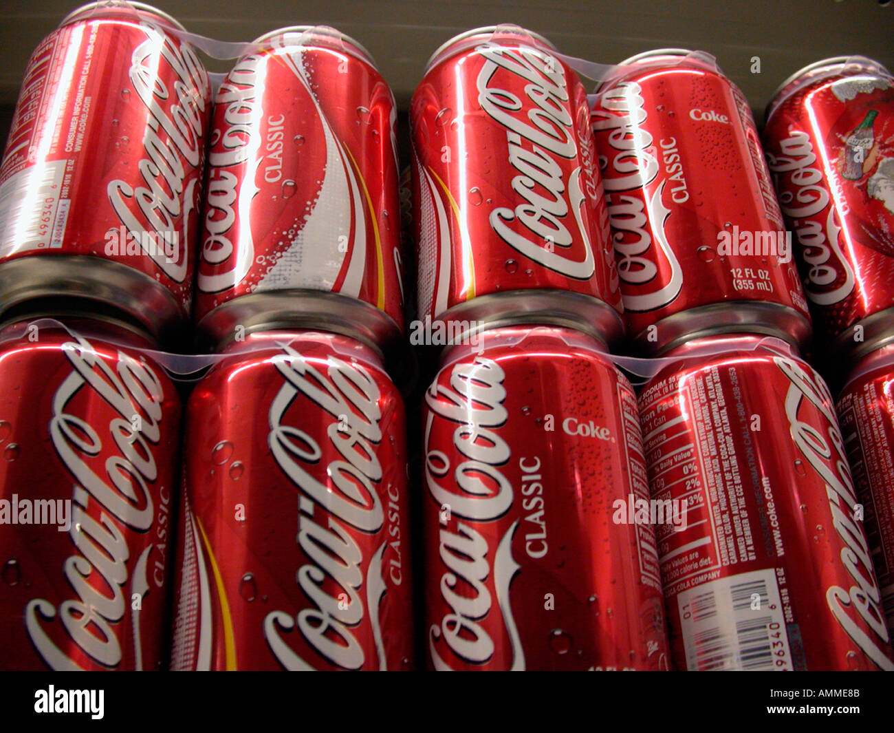 Cans of Coca Cola on display on a supermarket shelf Stock Photo - Alamy