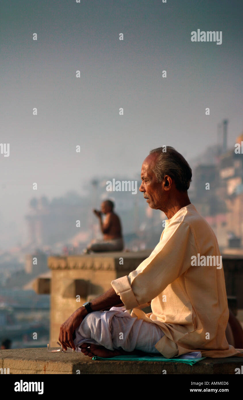 two men pray at the ganges varanasi Stock Photo - Alamy