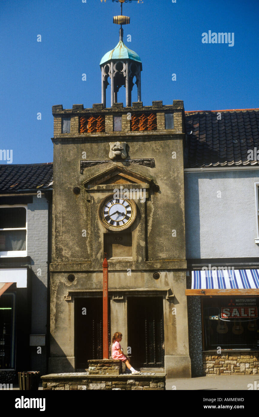 Girl sitting on a stoop in Watton England Stock Photo - Alamy