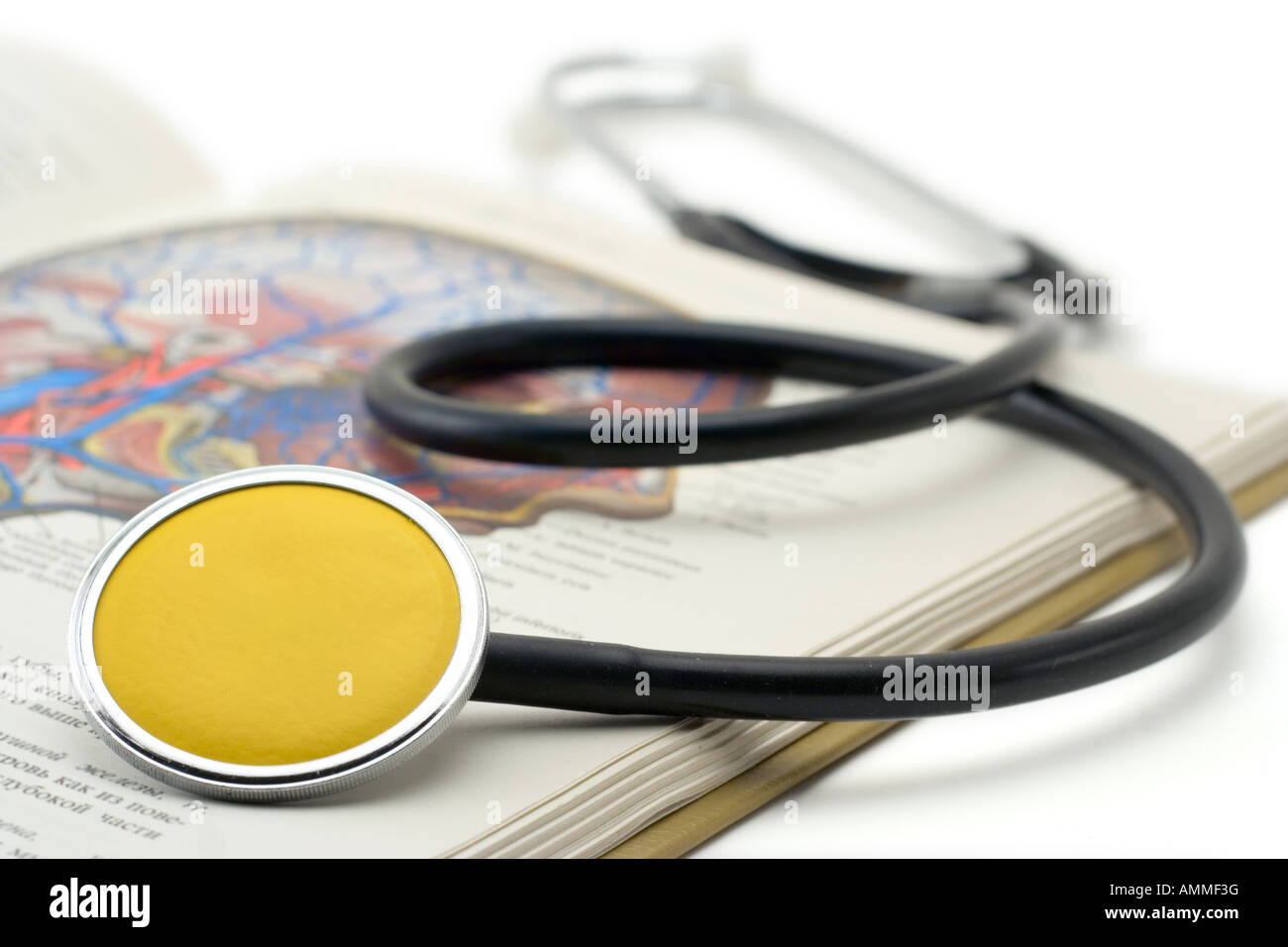 Yellow stethoscope on a medical book Stock Photo - Alamy