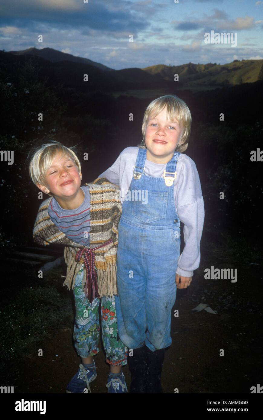 Two children and green sunset landscape in New Zealand Stock Photo - Alamy