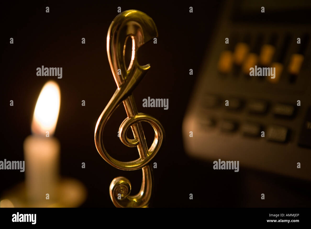 Sound station and treble clef and burning candle Stock Photo - Alamy