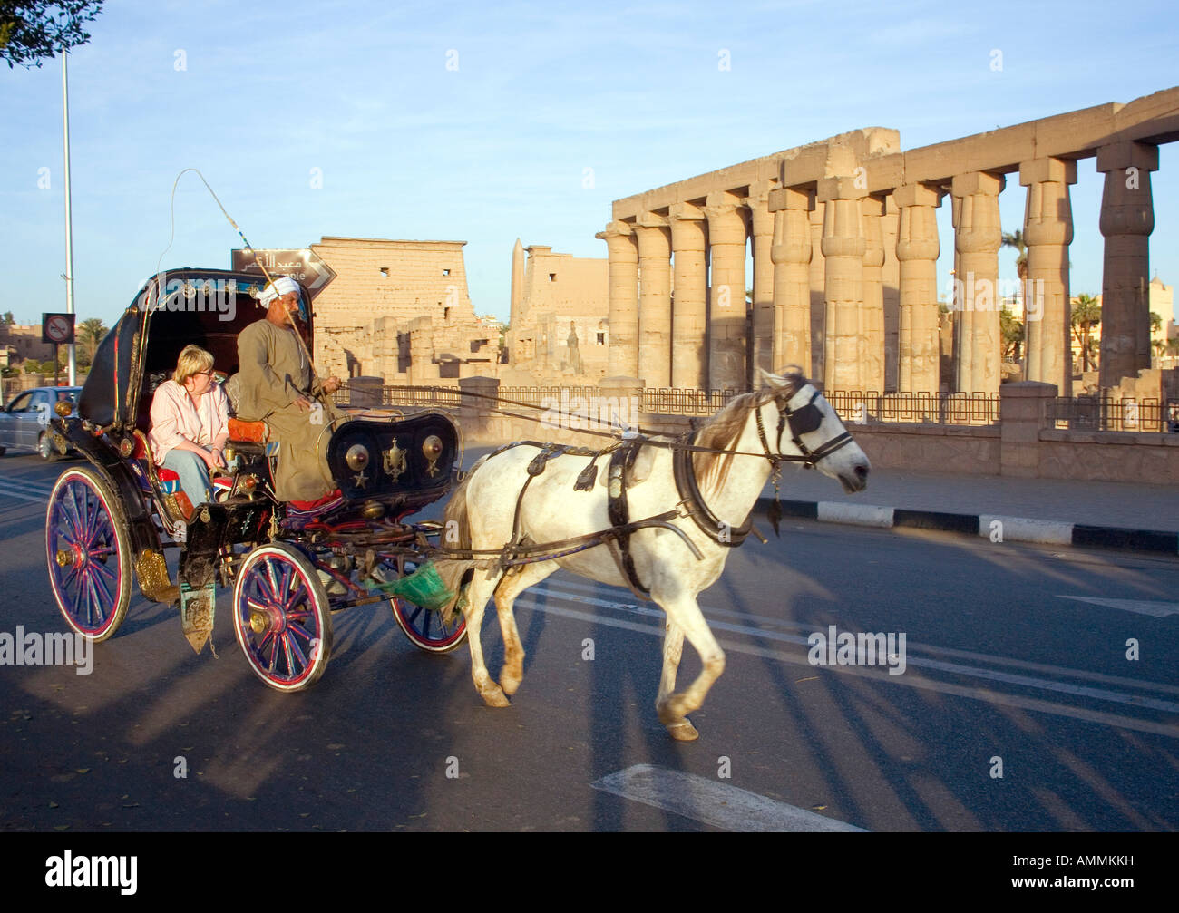 Tourists riding in a Caleche horse drawn carriage just outside the ...