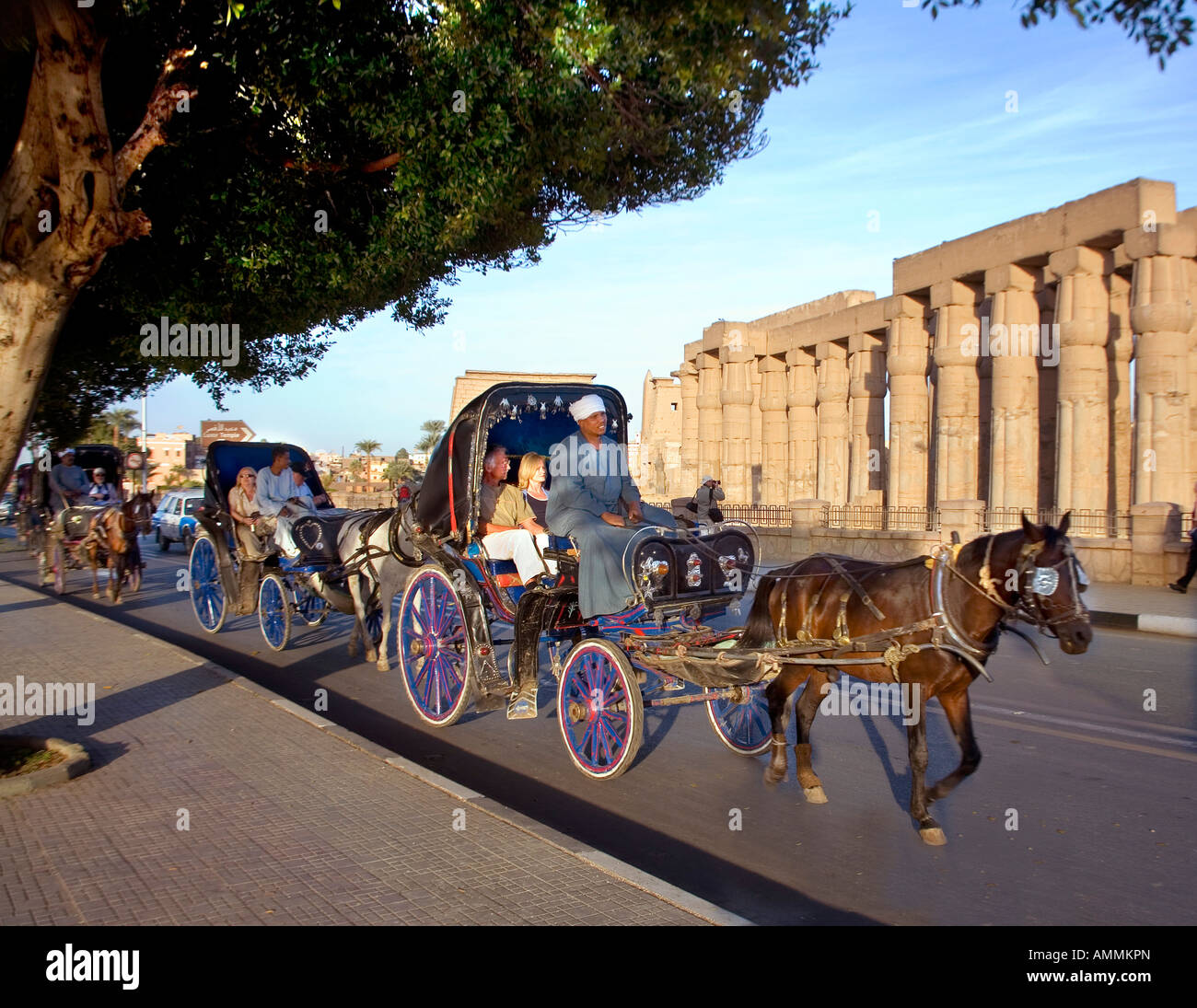 Tourists riding in a Caleche horse drawn carriage just outside the ...
