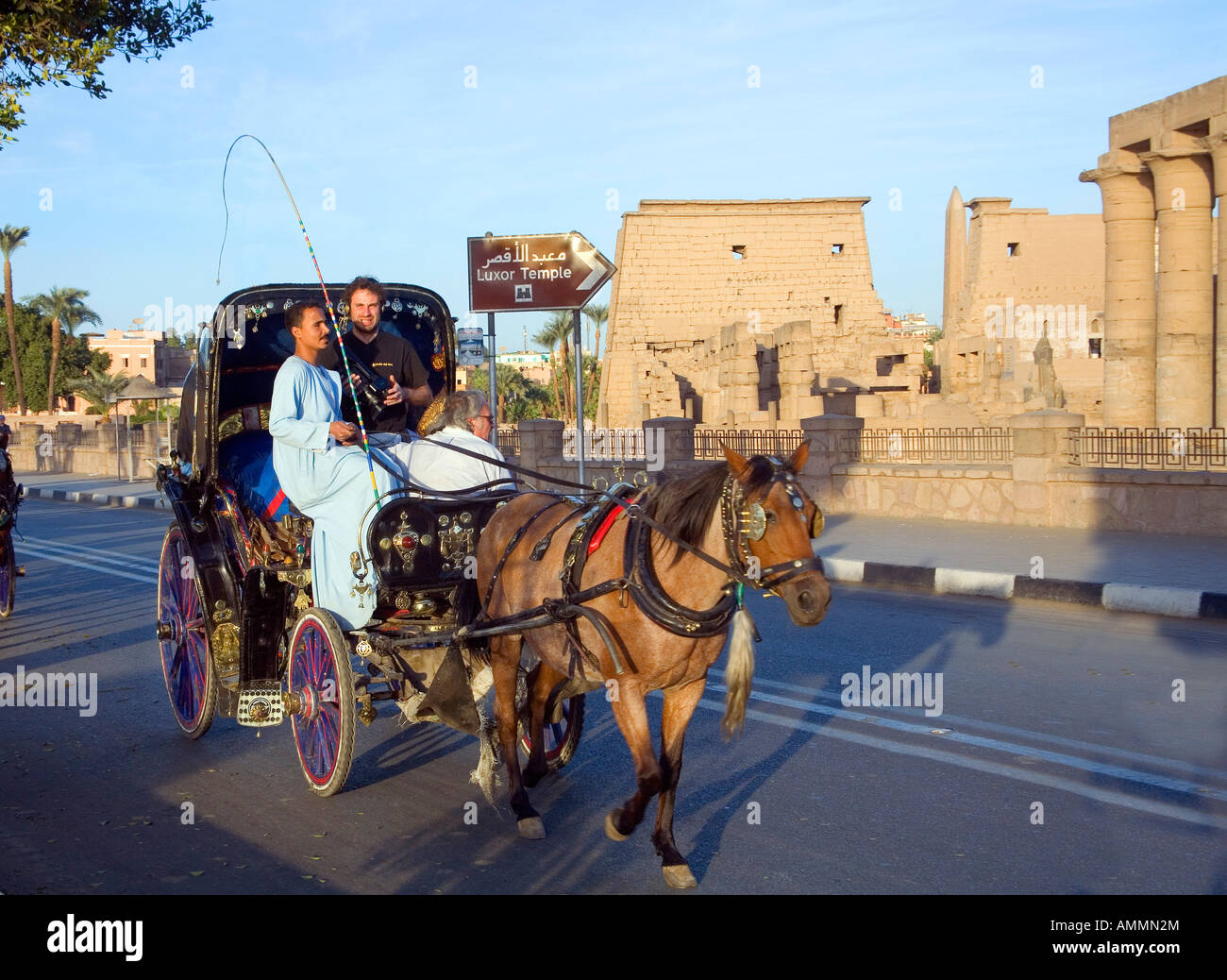 Tourists riding in a Caleche horse drawn carriage just outside the ...