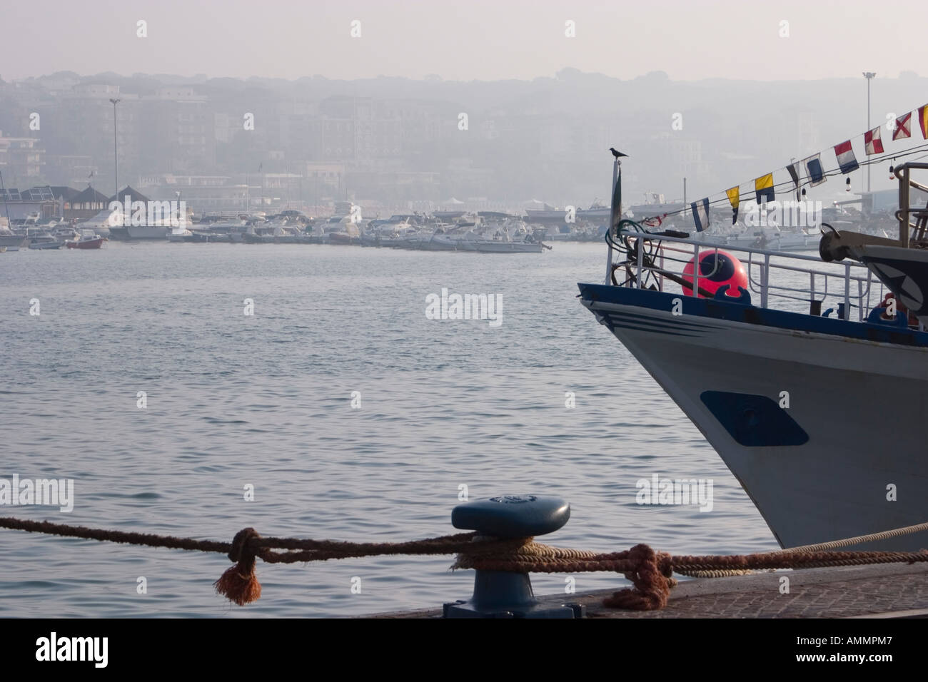 Sailing ship dressed overall with their signal flags in Anzio, Italy ...