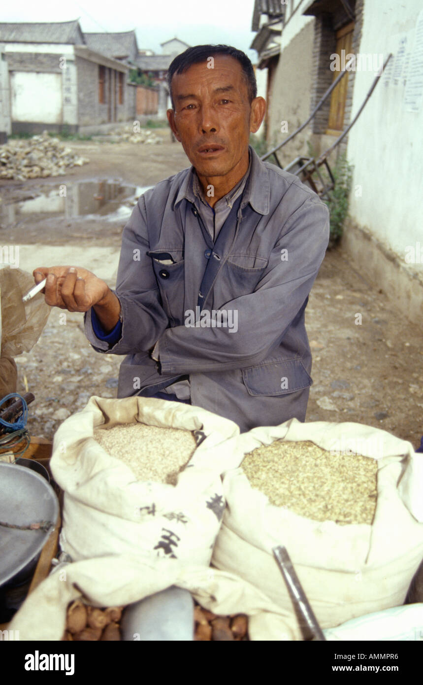 Man selling grains in Bei Village in Dali Yunnan Province People s ...