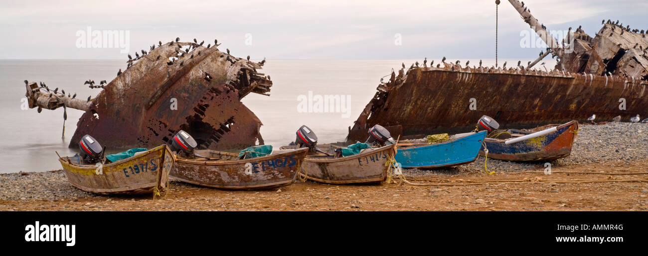 Small fishing boats and shipwreck at point San Jacinto, Pacific coast ...