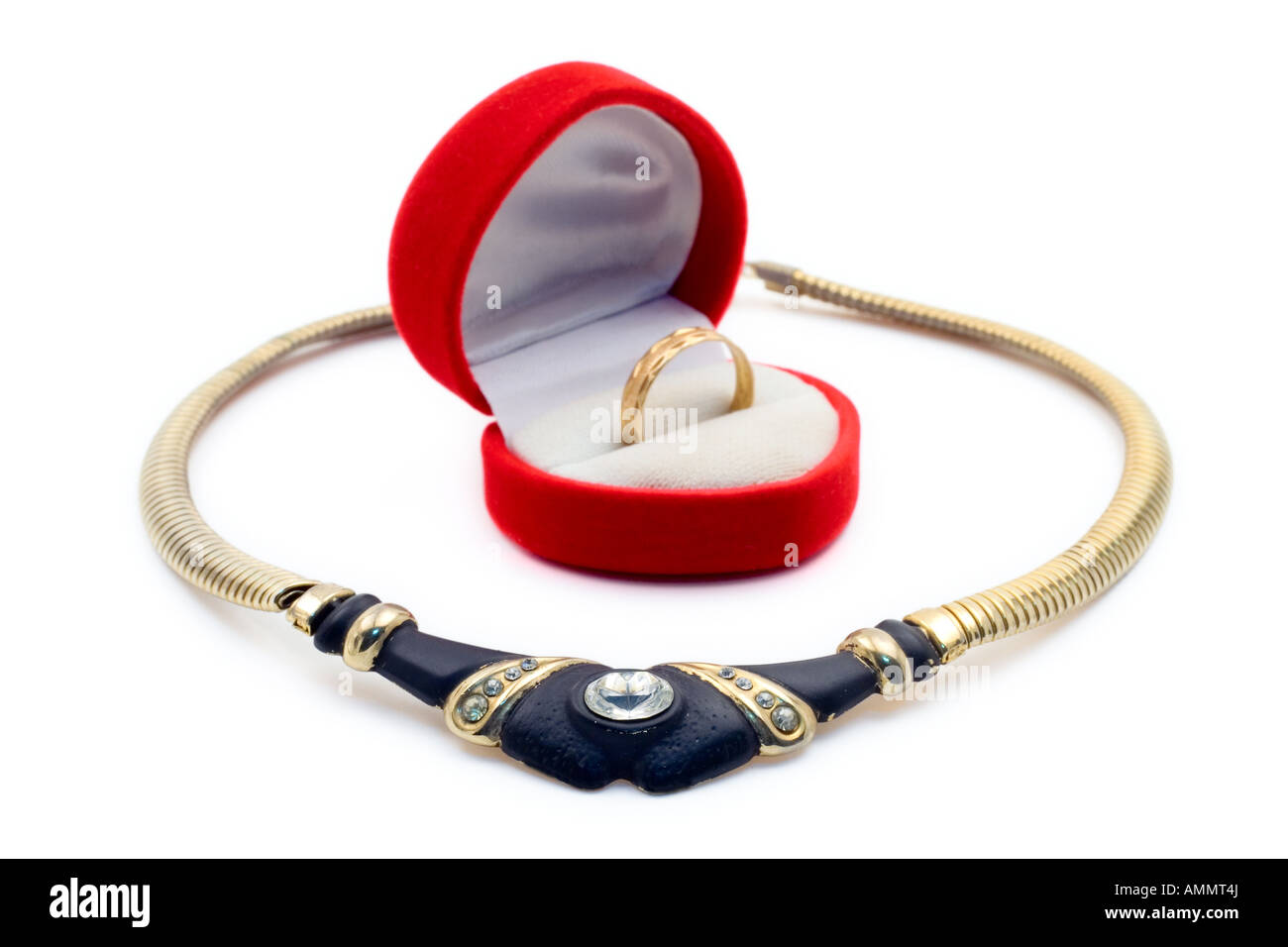 Golden necklace and a ring Stock Photo - Alamy