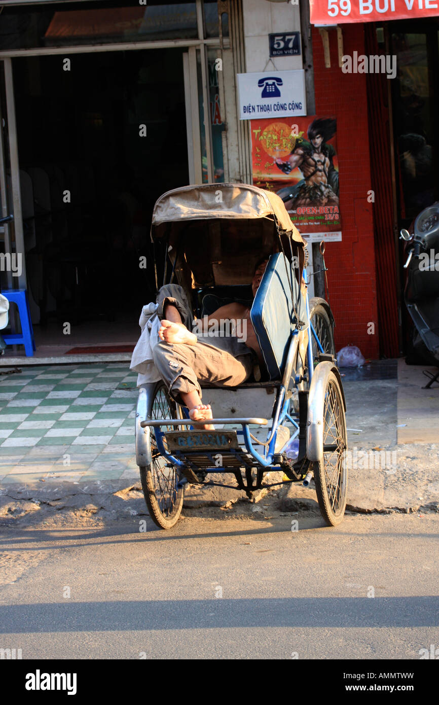 Rickshaw driver relaxing Stock Photo - Alamy