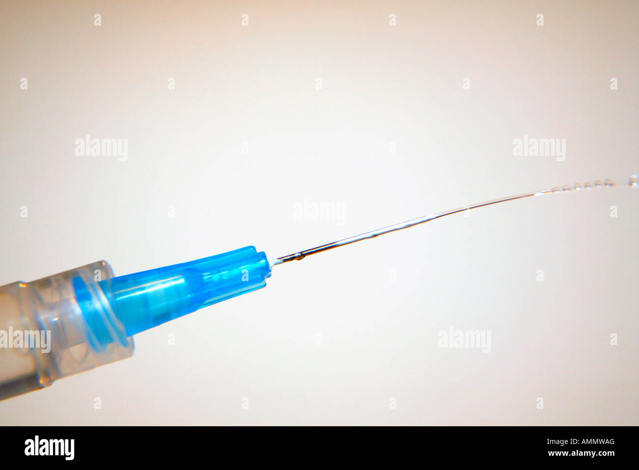 Hypodermic needle in use Stock Photo - Alamy