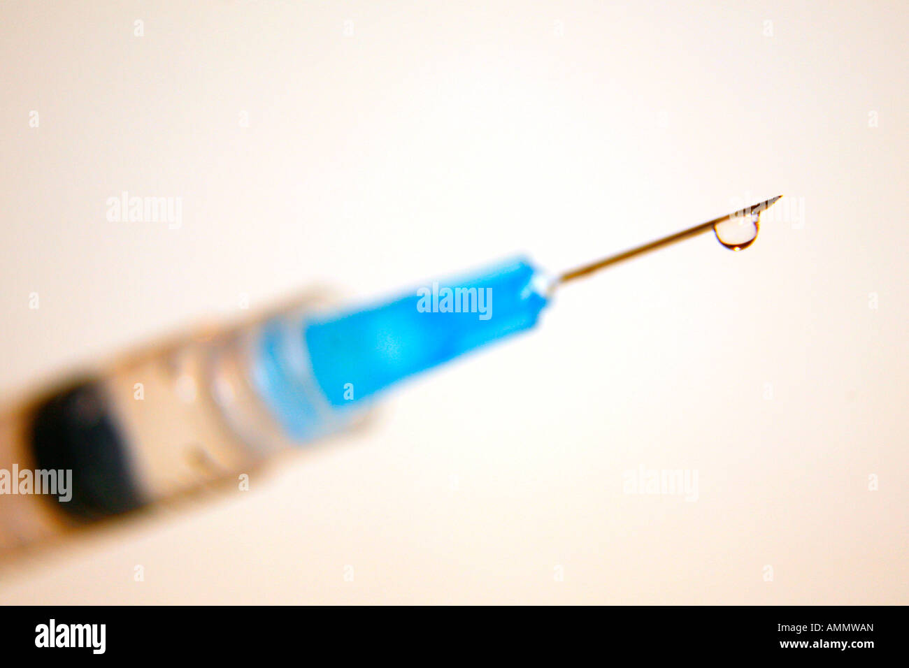 Hypodermic needle in use Stock Photo - Alamy