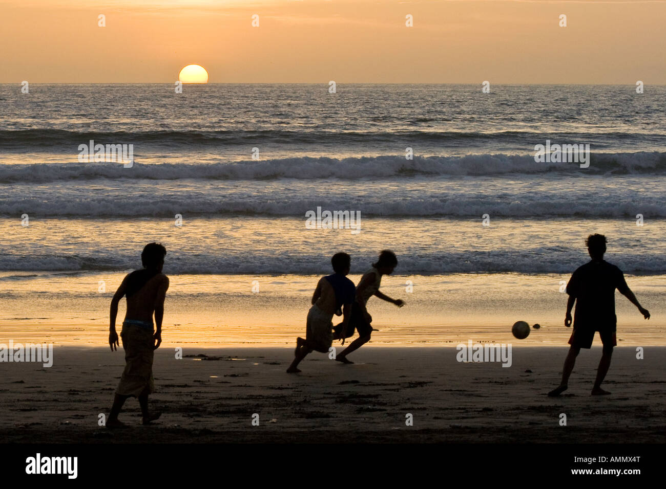 Indonesian Boys Playing Football at Sunset on Kuta Beach Bali Indonesia ...