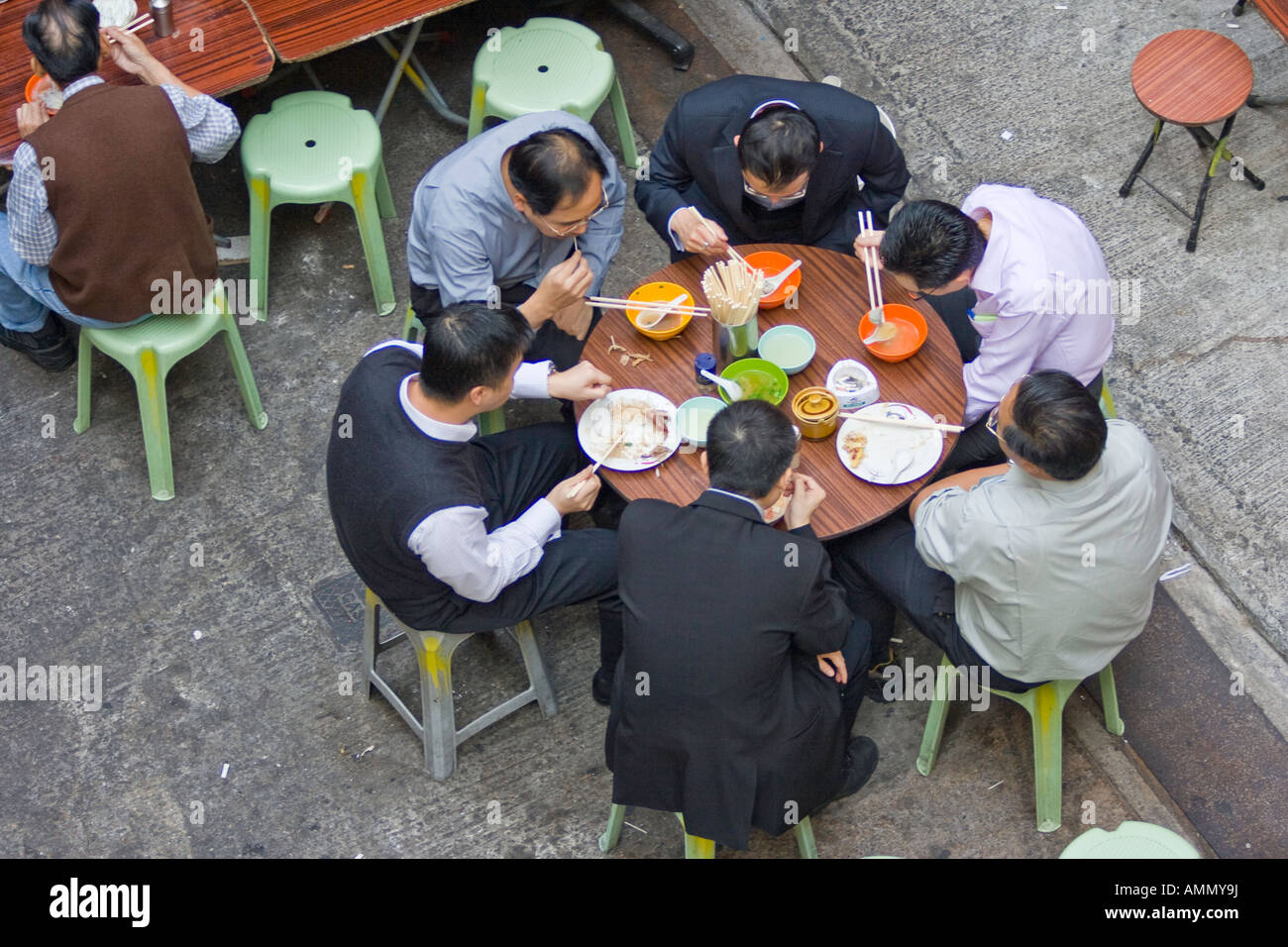 Local Chinese Men Eating Lunch at an Outdoor Restaurant Table Hong Kong ...