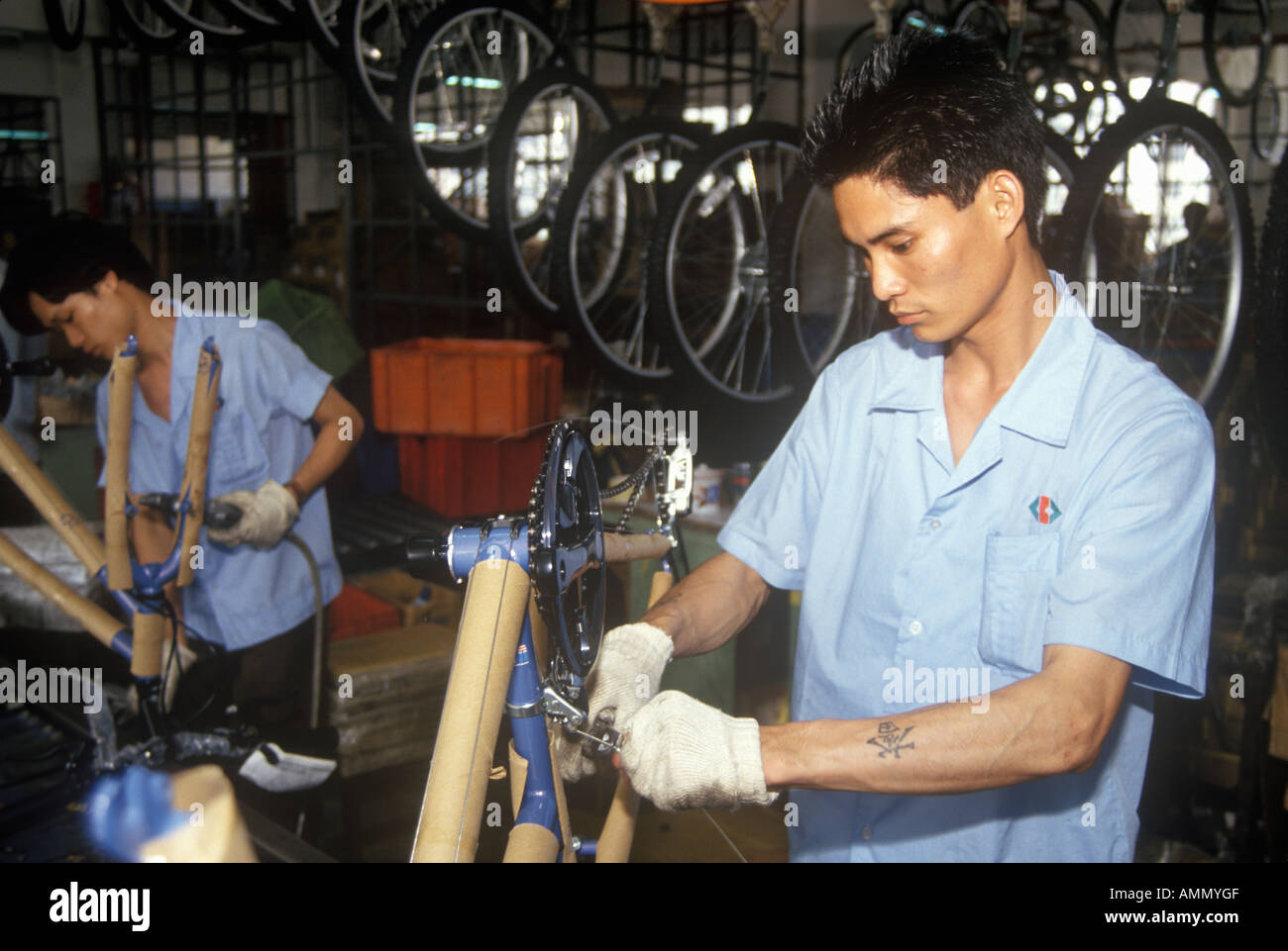 Factory workers at China Bicycle in Shenzhen in Guangdong Province ...