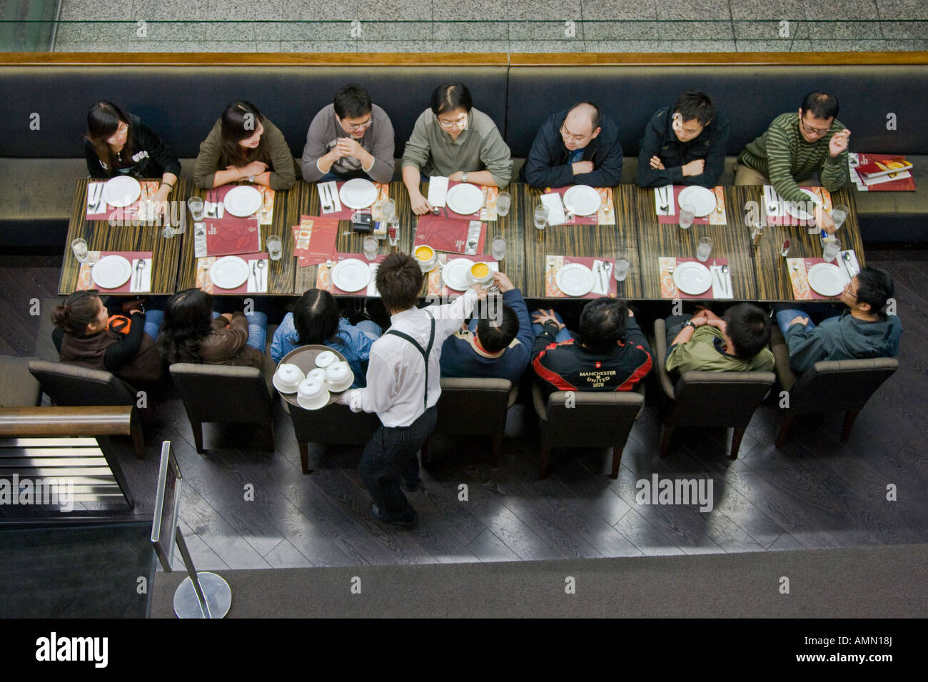 Group of People Eating at a Restaurant Inside HKG Hong Kong ...