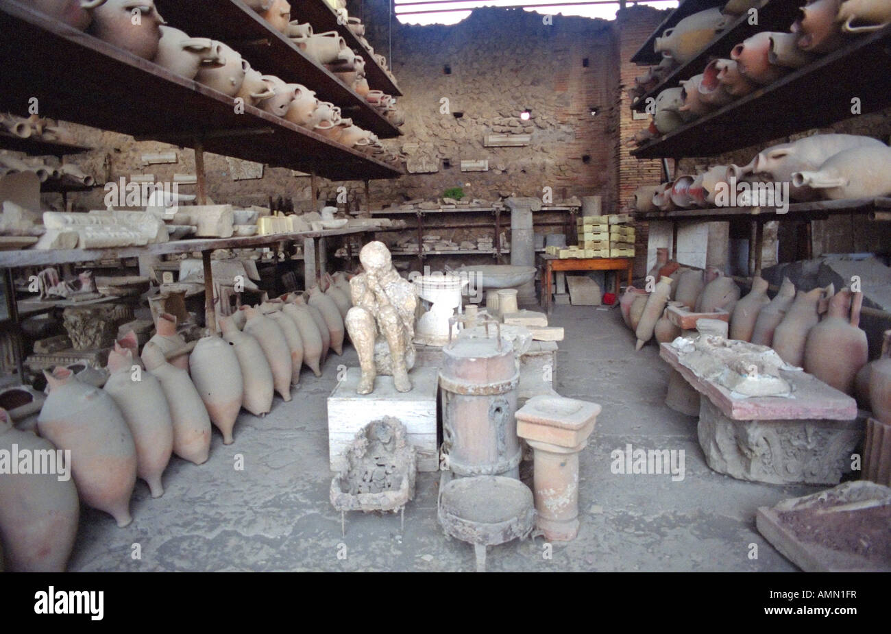 Casts and relics in a workshop at the ancient Roman ruins at Pompeii ...