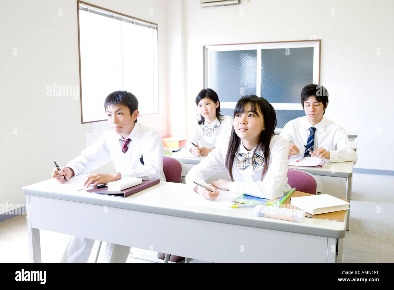 Middle school students studying Stock Photo - Alamy