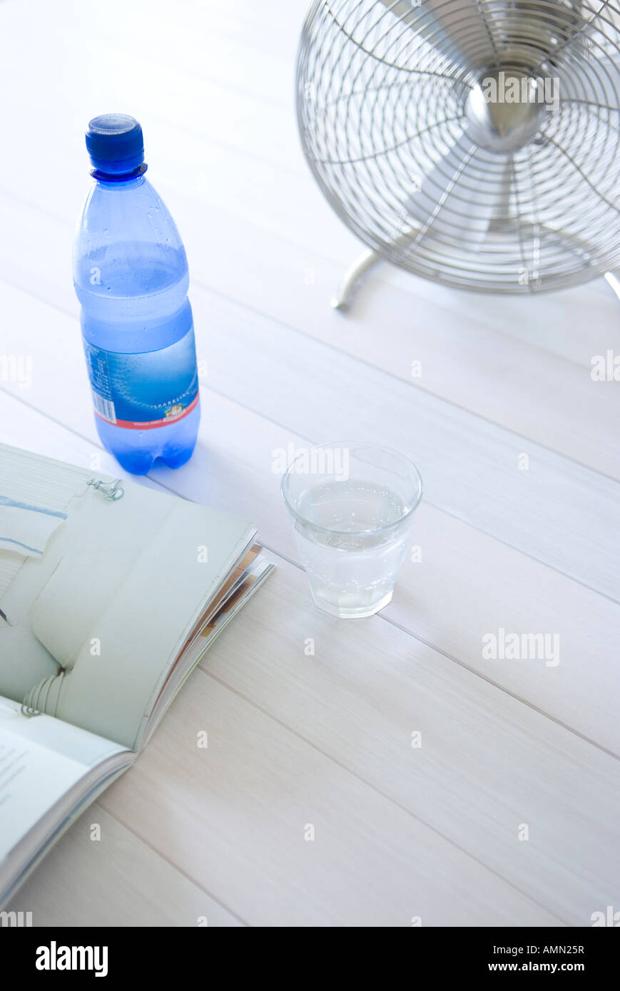 Fan and mineral water Stock Photo - Alamy