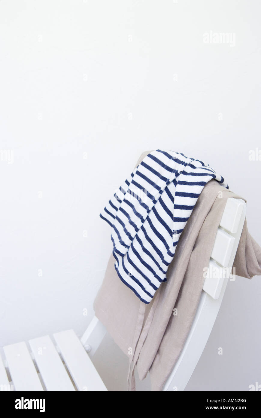 Shirt and pants on chair Stock Photo - Alamy
