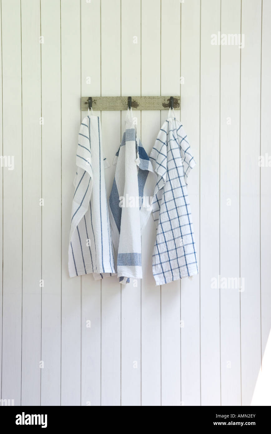Kitchen clothes hanging on wall Stock Photo - Alamy