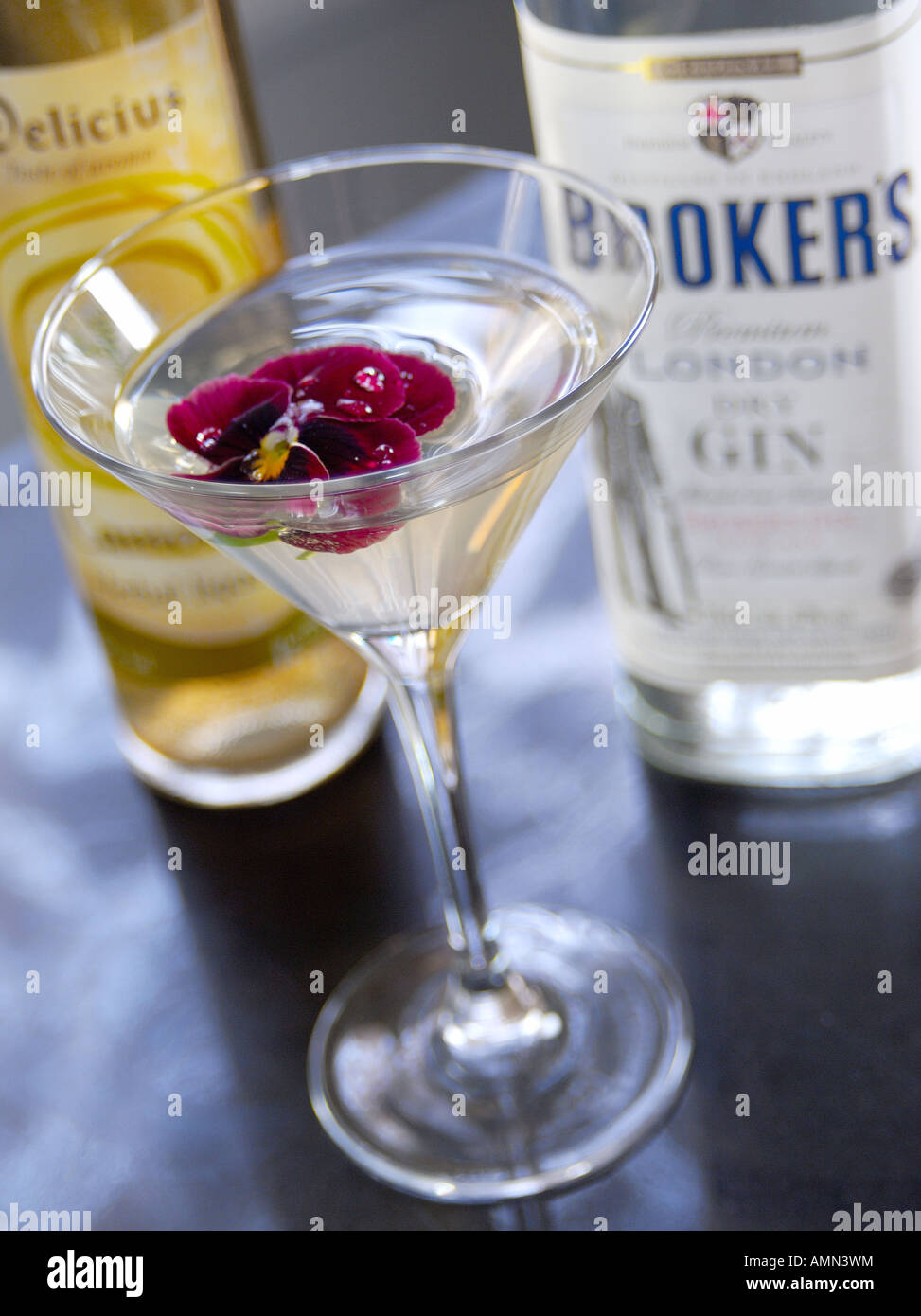Cocktail glass and flower Stock Photo - Alamy