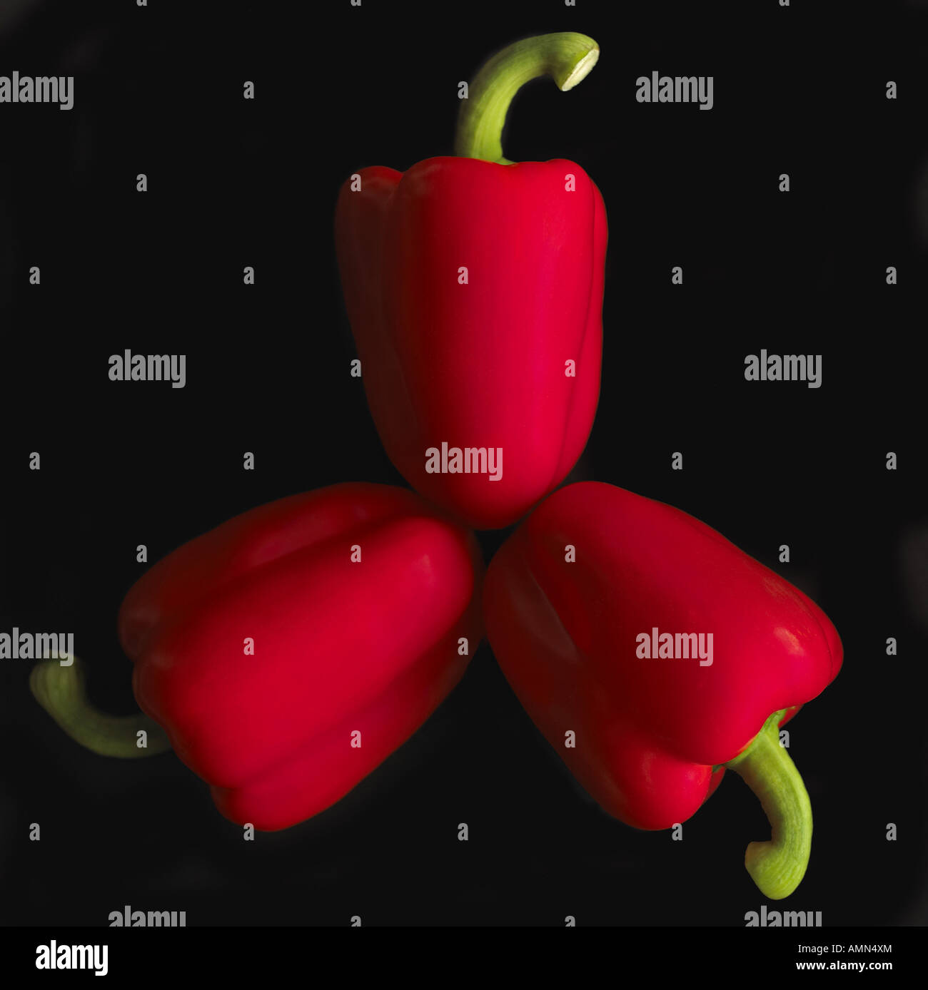 Three red peppers Stock Photo - Alamy