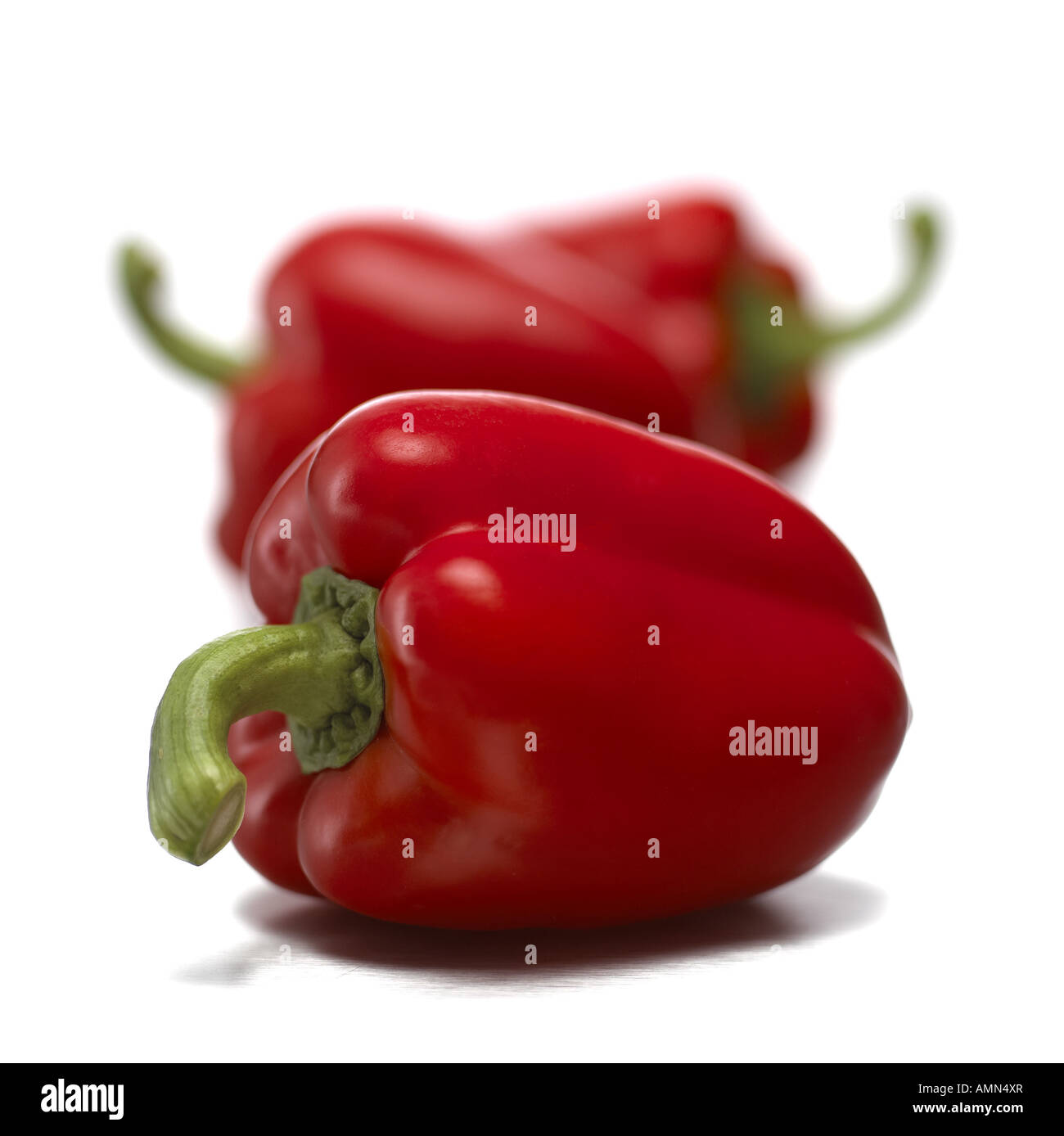 Three red peppers Stock Photo - Alamy