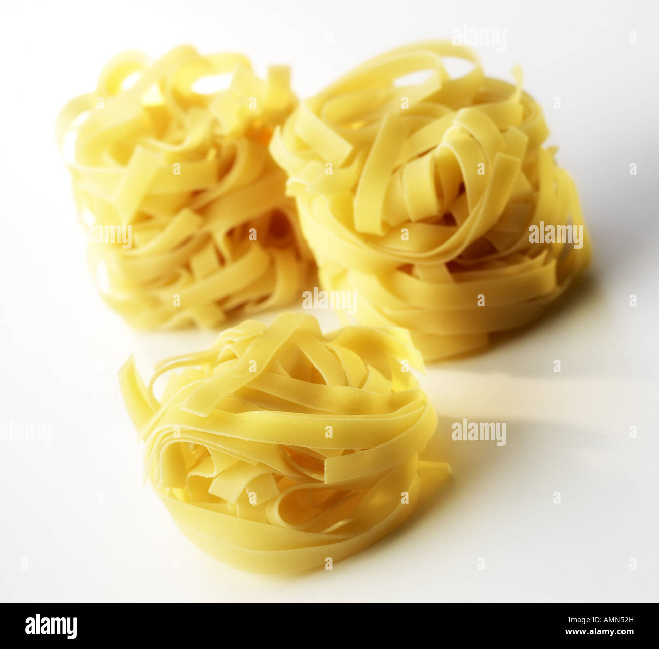 Dried tagliatelle pasta nests hi-res stock photography and images - Alamy