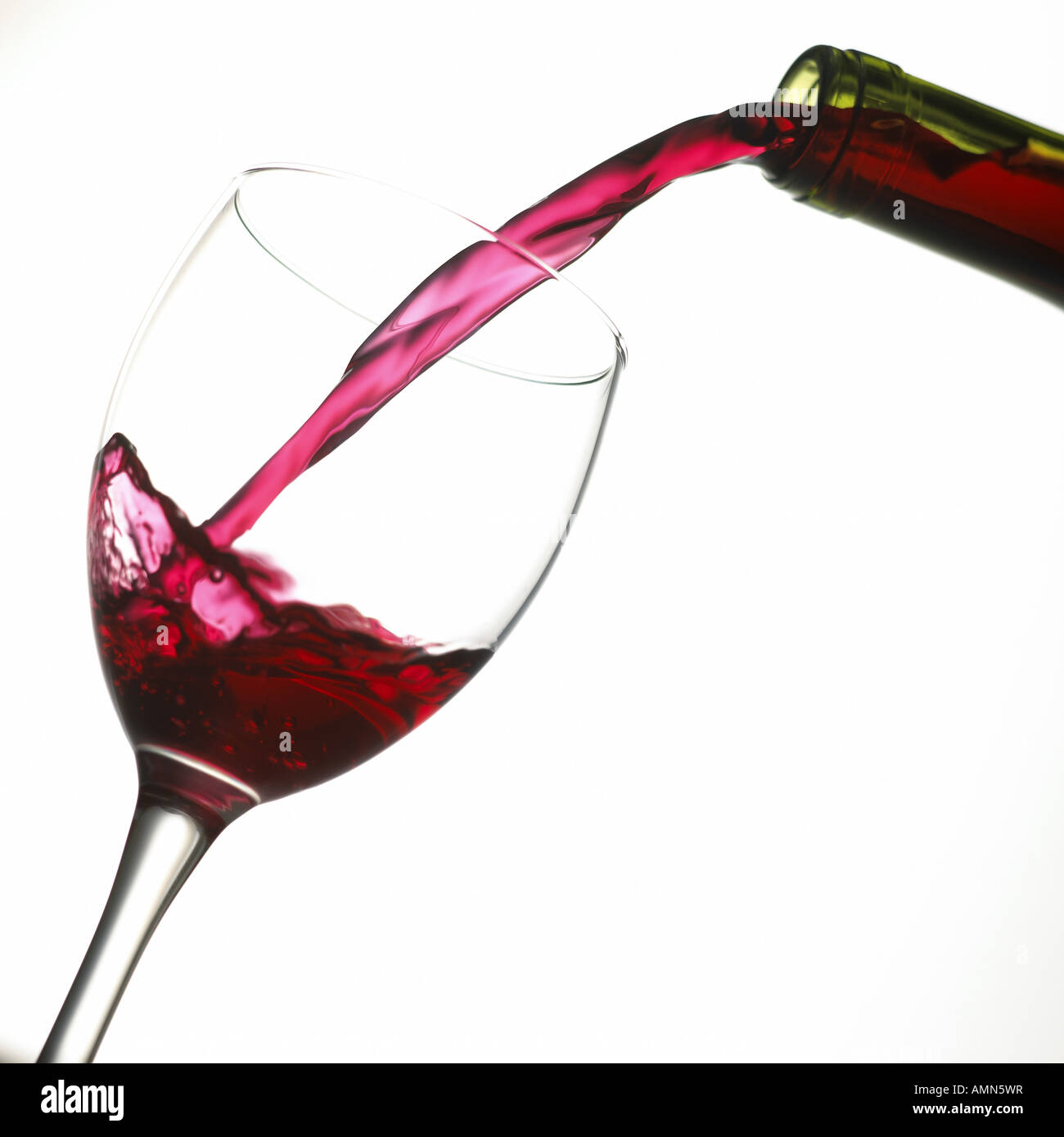 Pouring red wine Stock Photo - Alamy