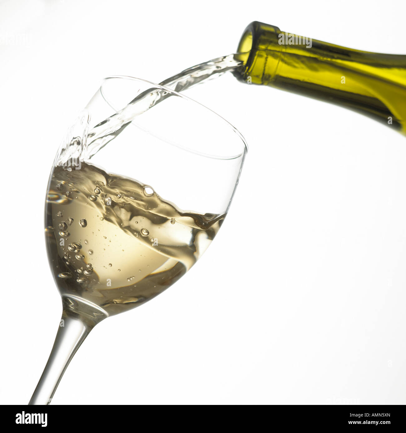 Pouring white wine Stock Photo - Alamy